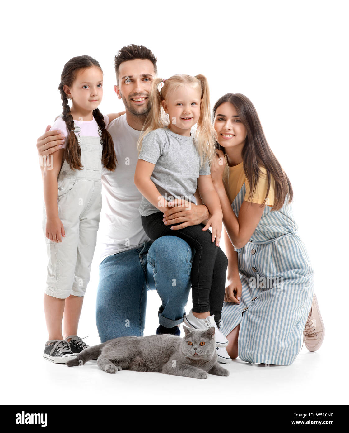 Happy family with cute cat on white background Stock Photo - Alamy