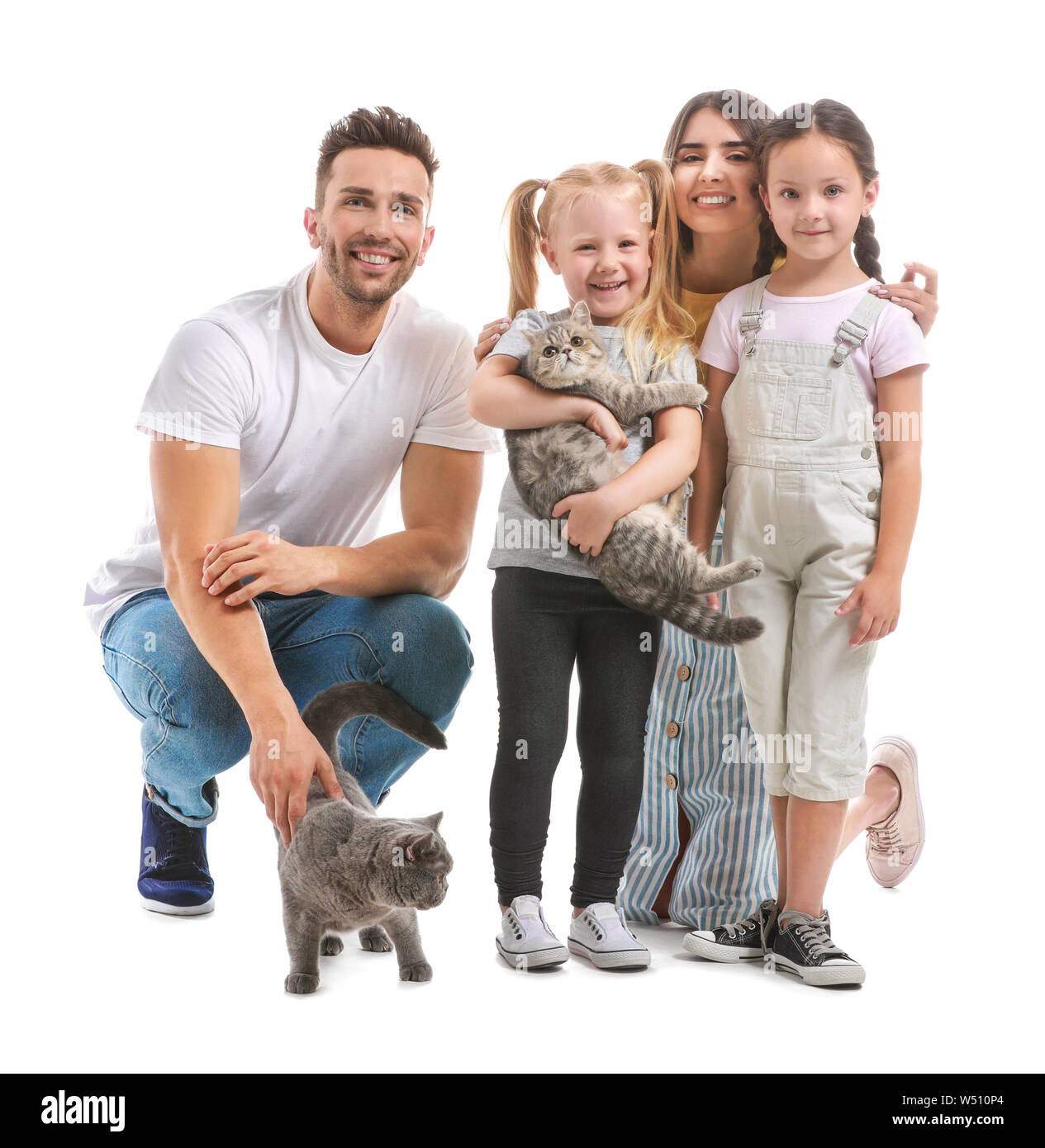 Happy family with cute cats on white background Stock Photo - Alamy