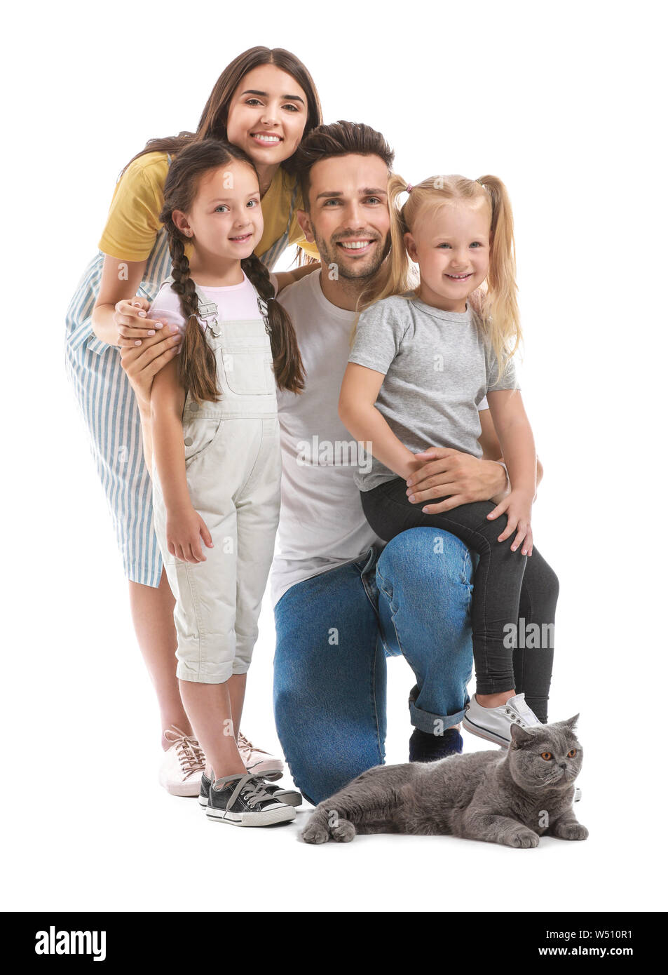 Happy family with cute cat on white background Stock Photo - Alamy