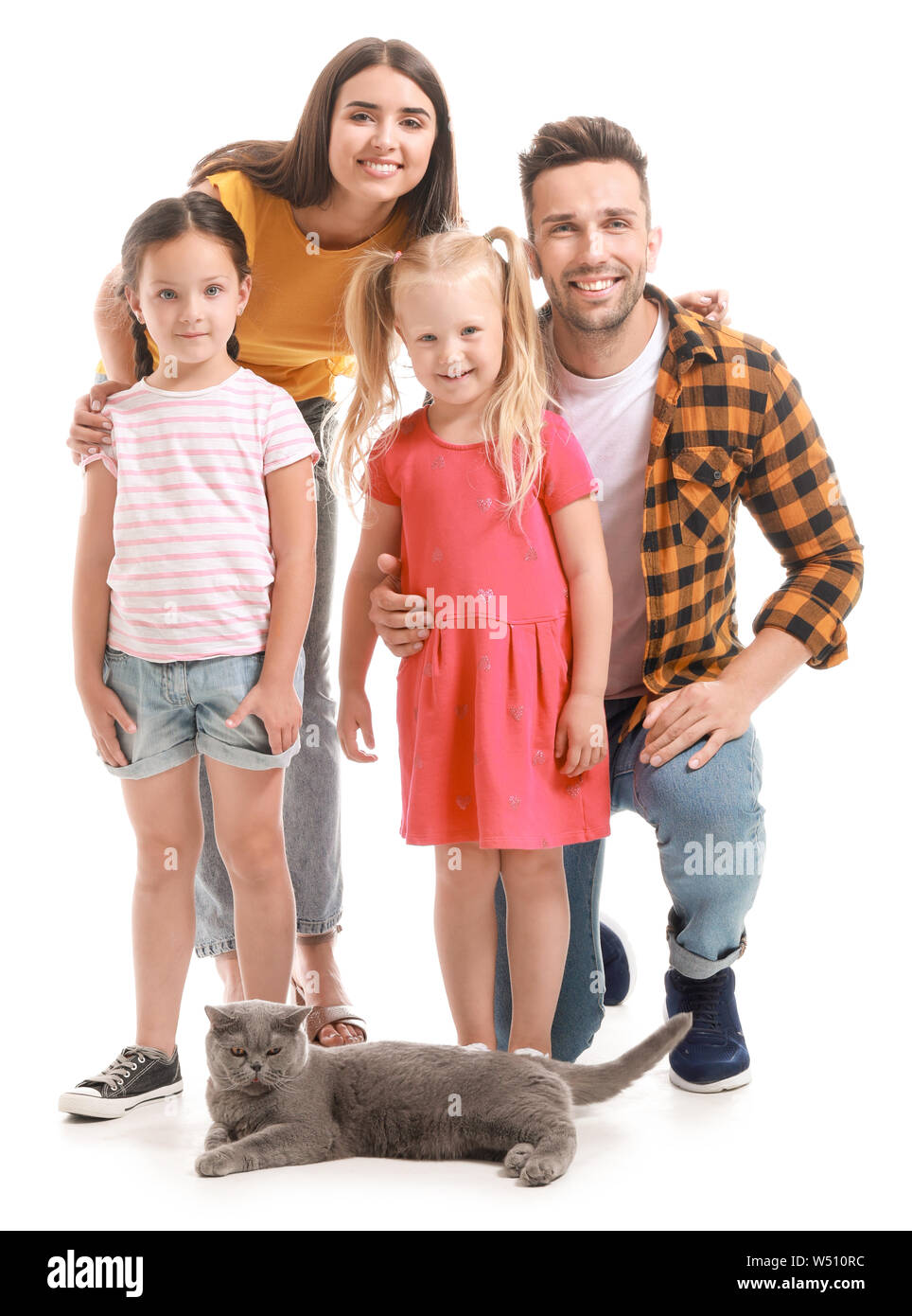 Happy family with cute cat on white background Stock Photo - Alamy