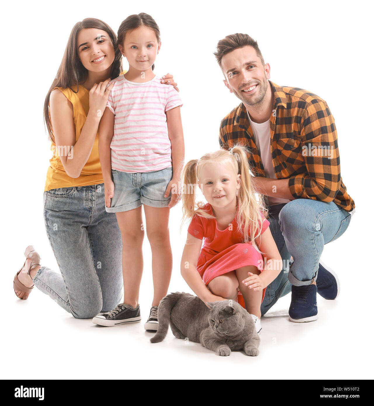 Happy family with cute cat on white background Stock Photo - Alamy