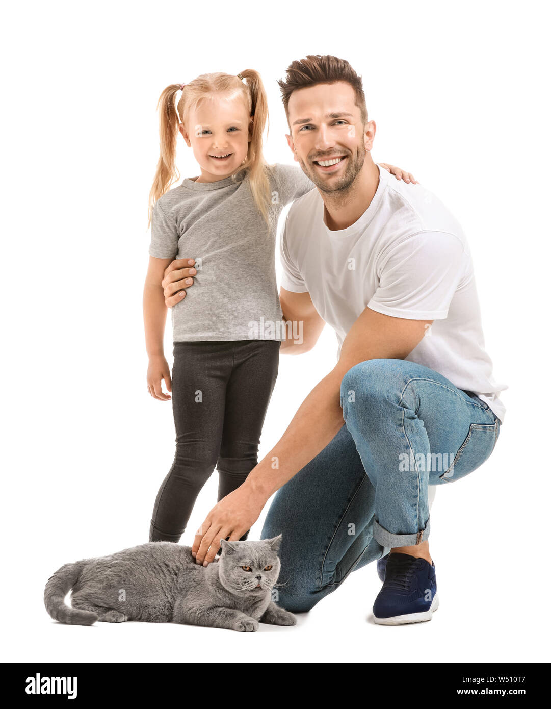 Happy father and daughter with cute cat on white background Stock Photo ...