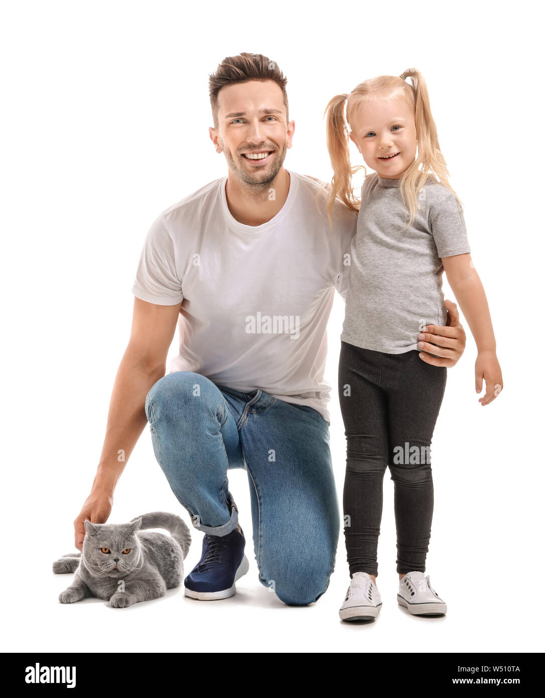 Happy father and daughter with cute cat on white background Stock Photo ...