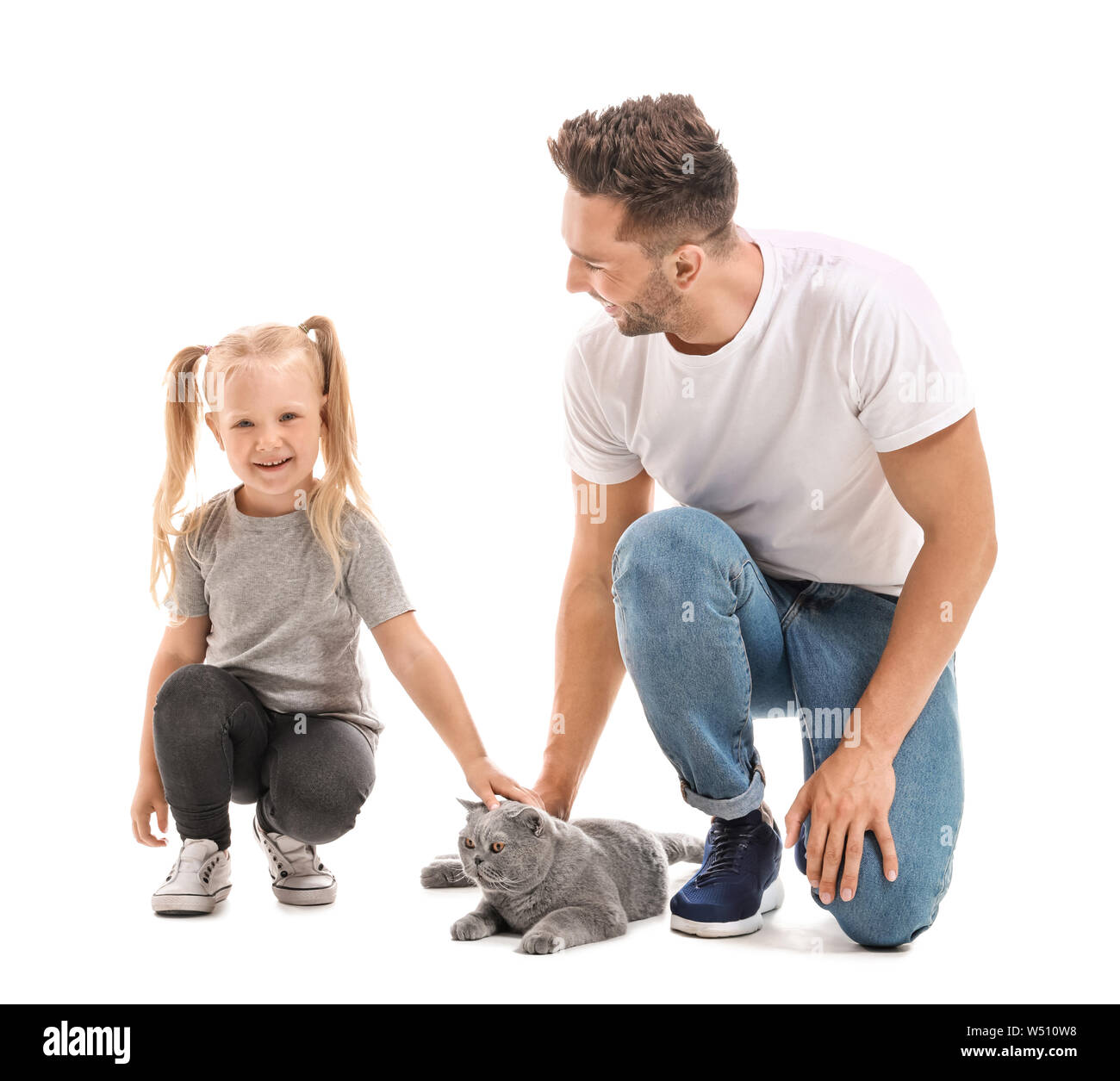 Happy father and daughter with cute cat on white background Stock Photo ...