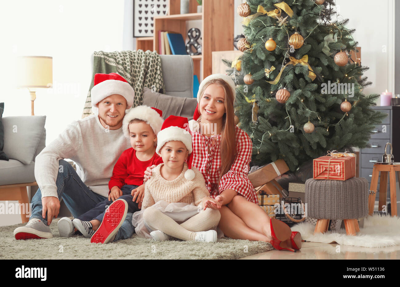 Happy family at home on Christmas eve Stock Photo - Alamy