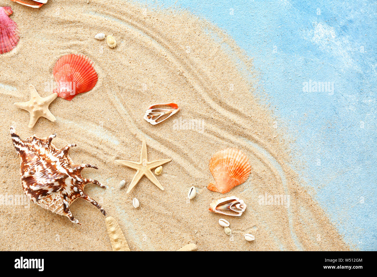 Beautiful sea shells, starfish and sand on color background Stock Photo ...
