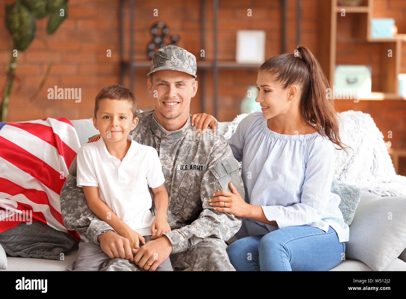 Happy military man with his family at home Stock Photo - Alamy