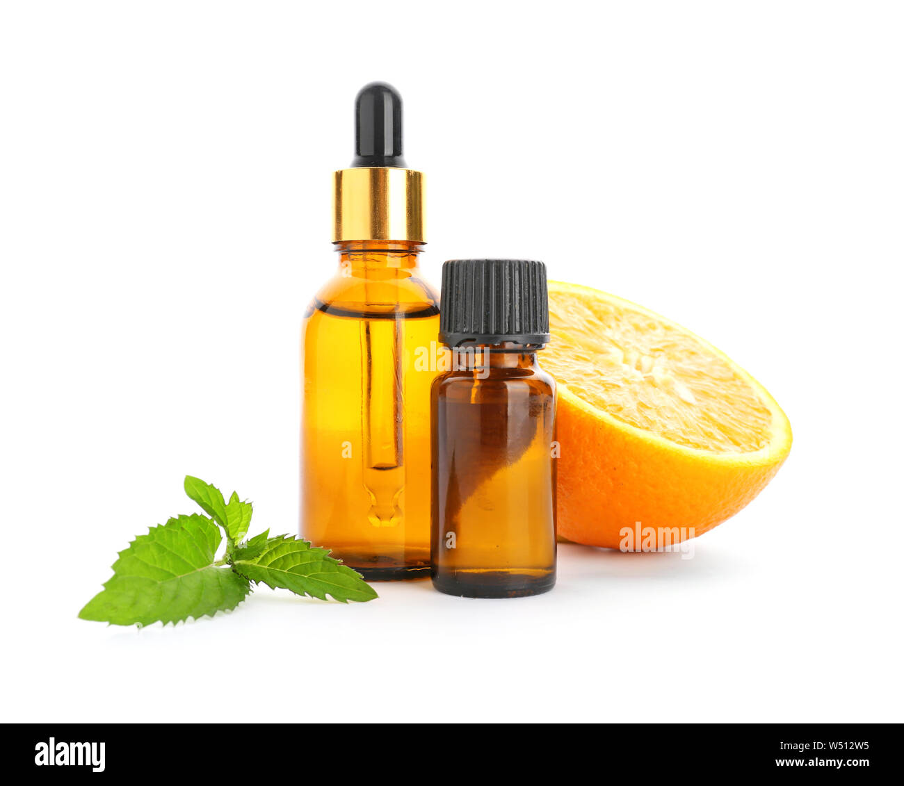 Citrus essential oil on white background Stock Photo - Alamy