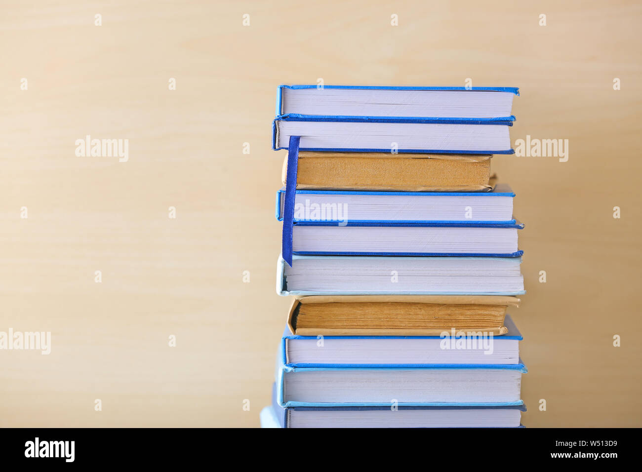 Stack of books on light background Stock Photo - Alamy