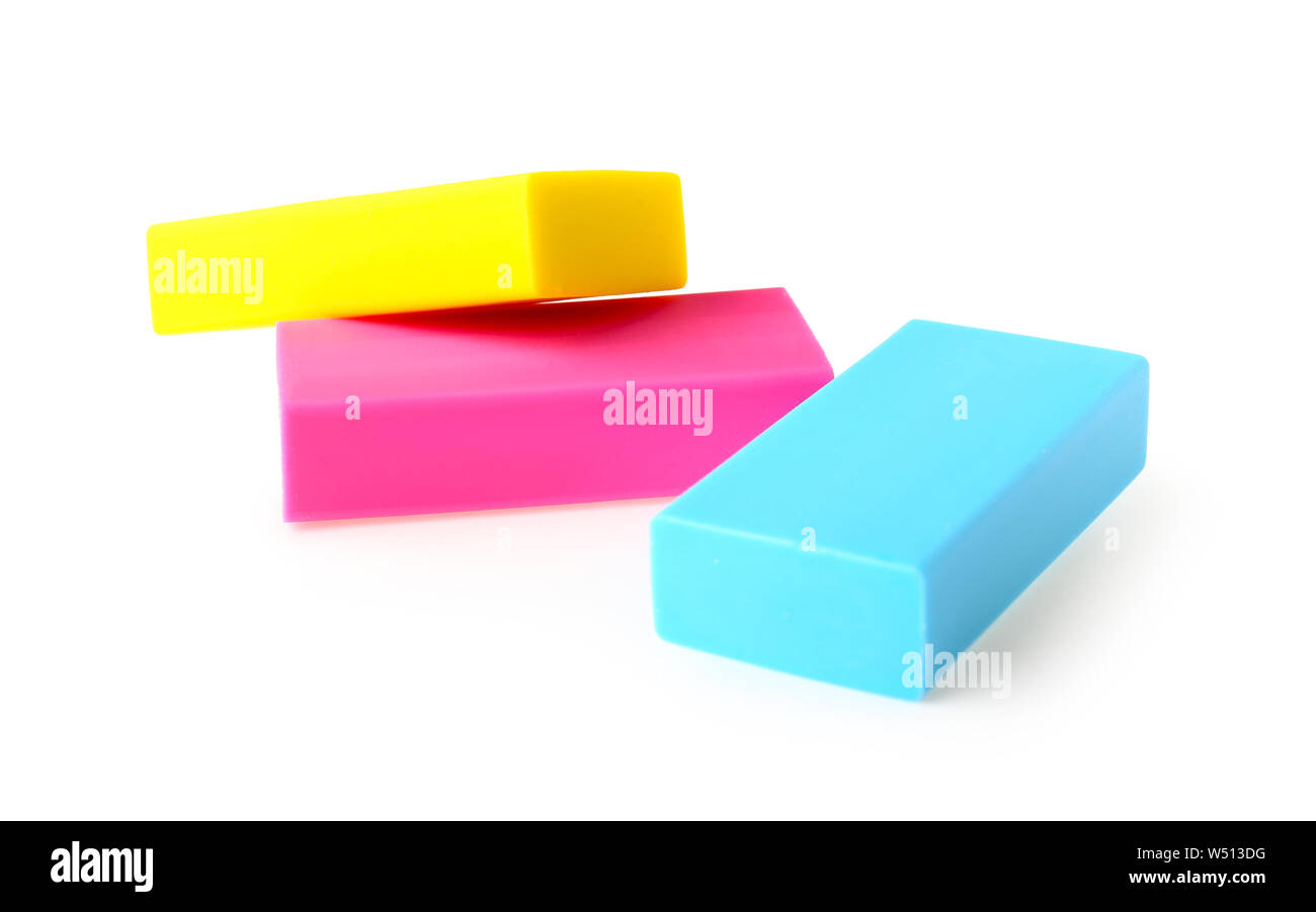 Color erasers on white background Stock Photo - Alamy