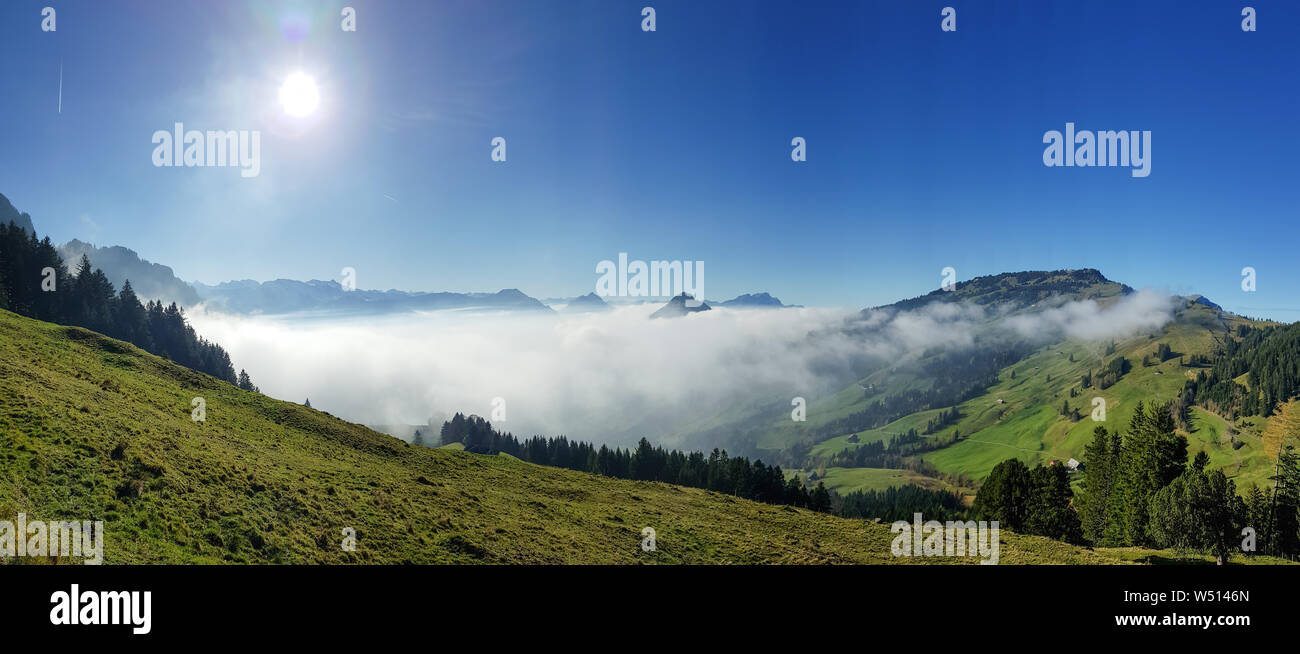 Switzerland alps clouds flare hi-res stock photography and images - Alamy