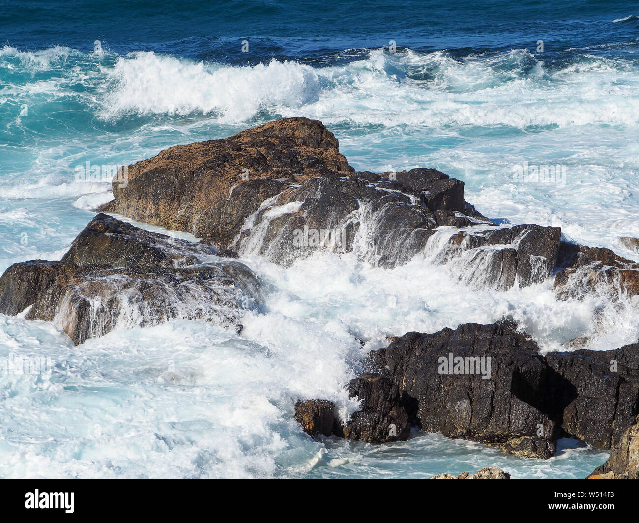 Waves Crashing Against Rocks High Resolution Stock Photography and ...