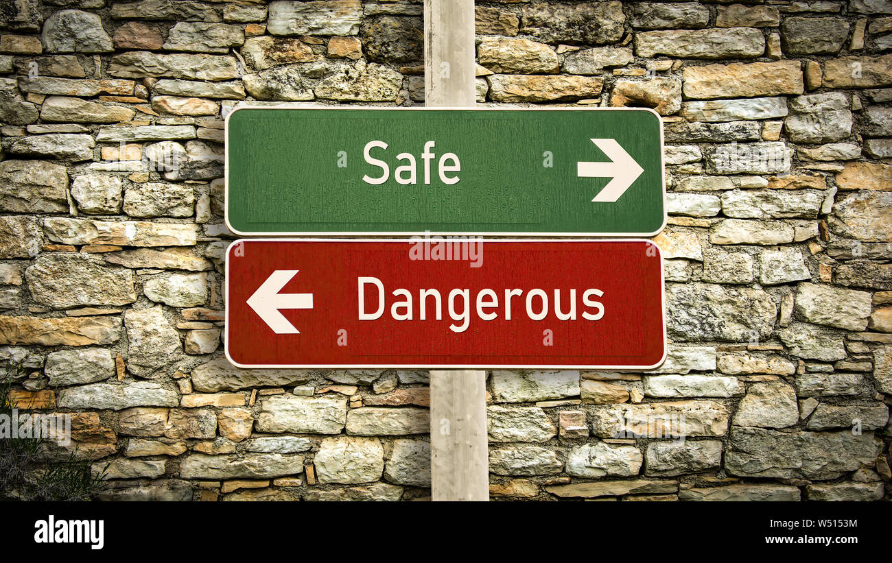 Street Sign the Direction Way to Safe versus Dangerous Stock Photo - Alamy