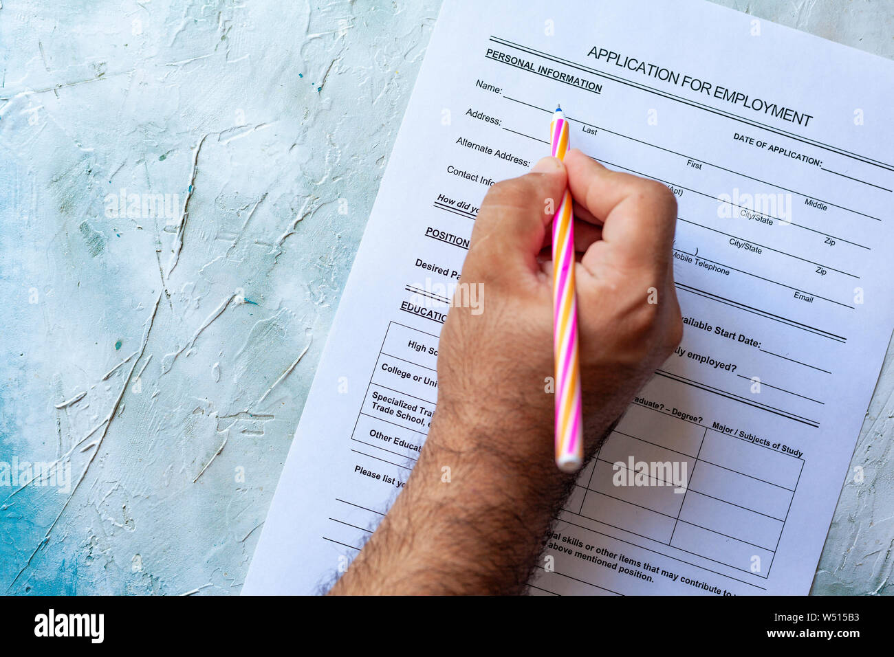 Hand filling Standard Application for Employment. HR, Hiring, Applicant ...