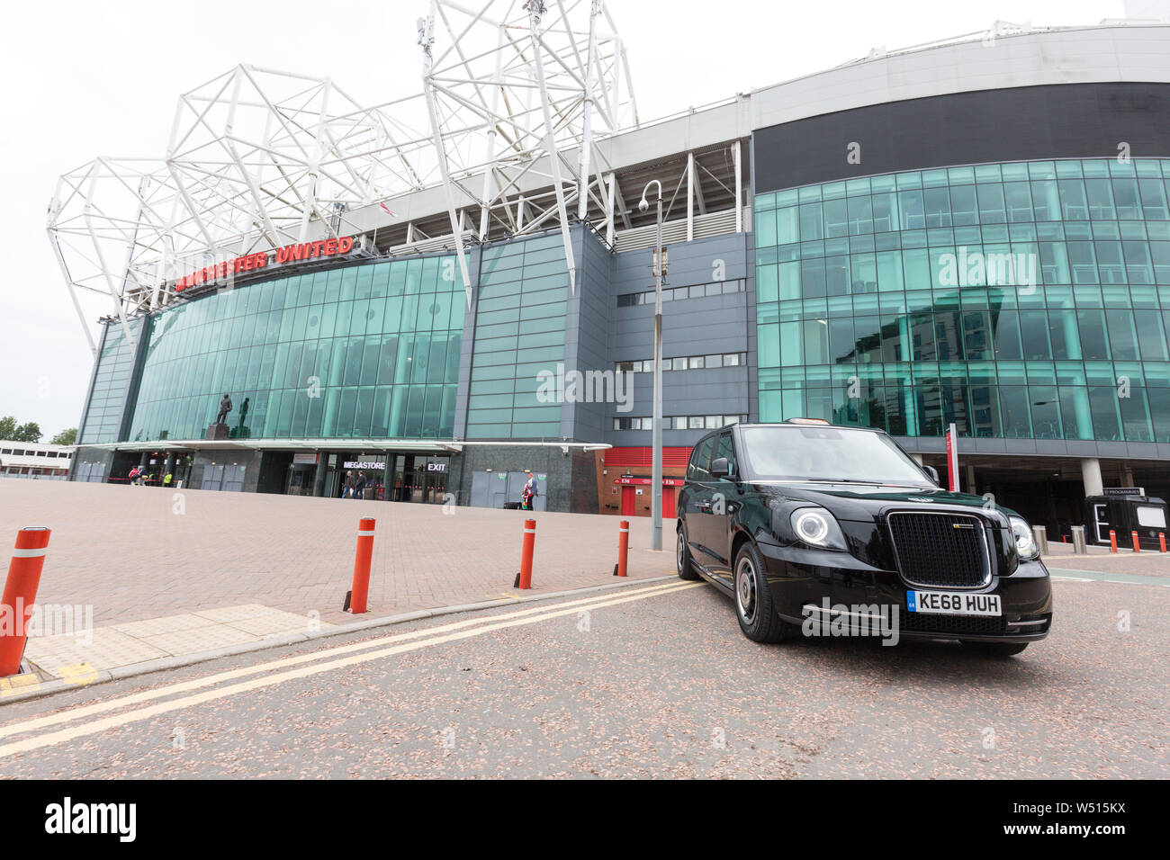 Electric black cab outside Old Trafford Football Ground Stock Photo - Alamy