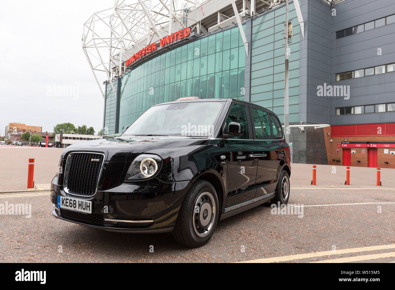 Electric black cab outside Old Trafford Football Ground Stock Photo - Alamy