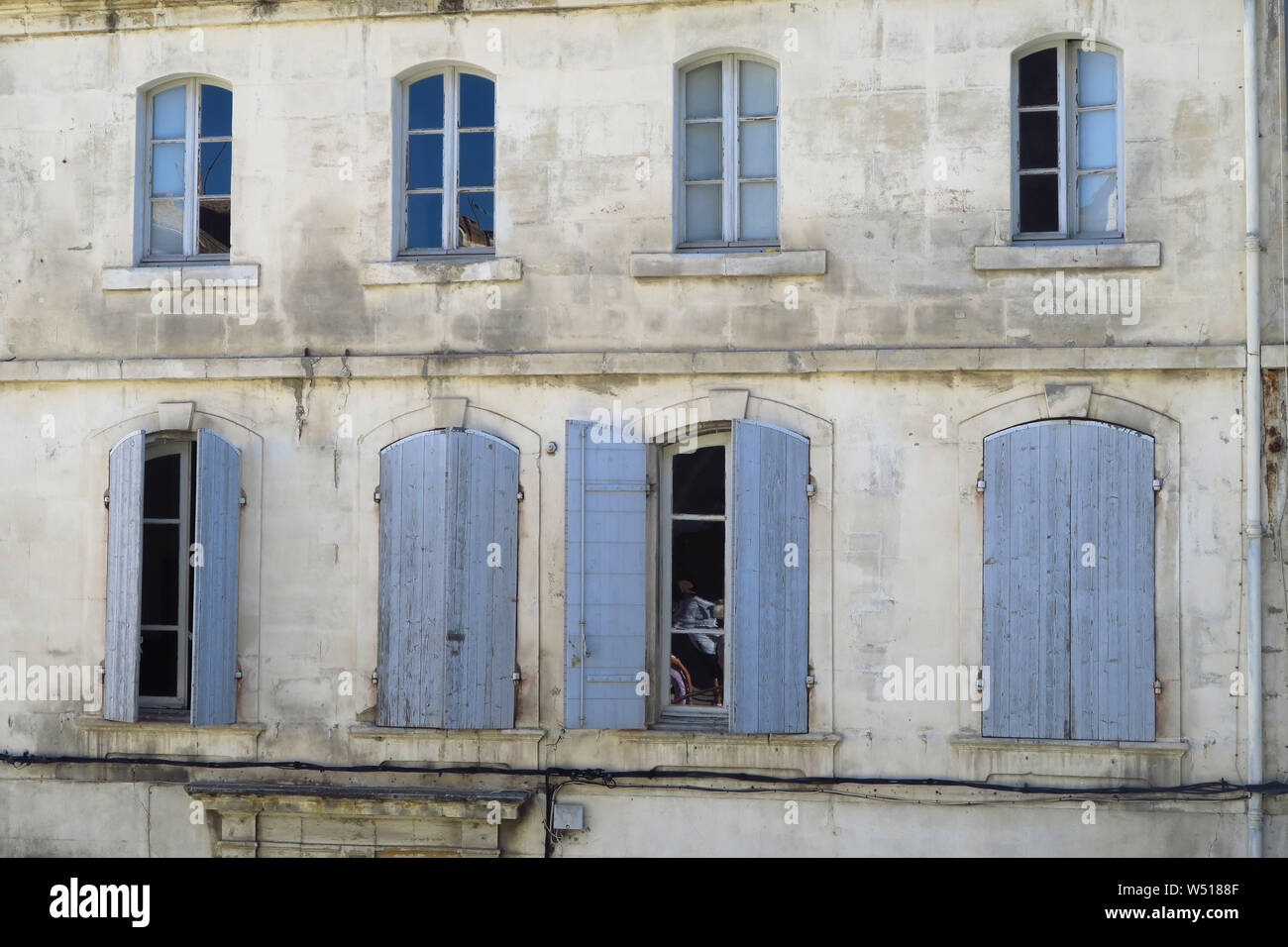 Shuttered windows on buildings in the French town of Arles Stock Photo ...