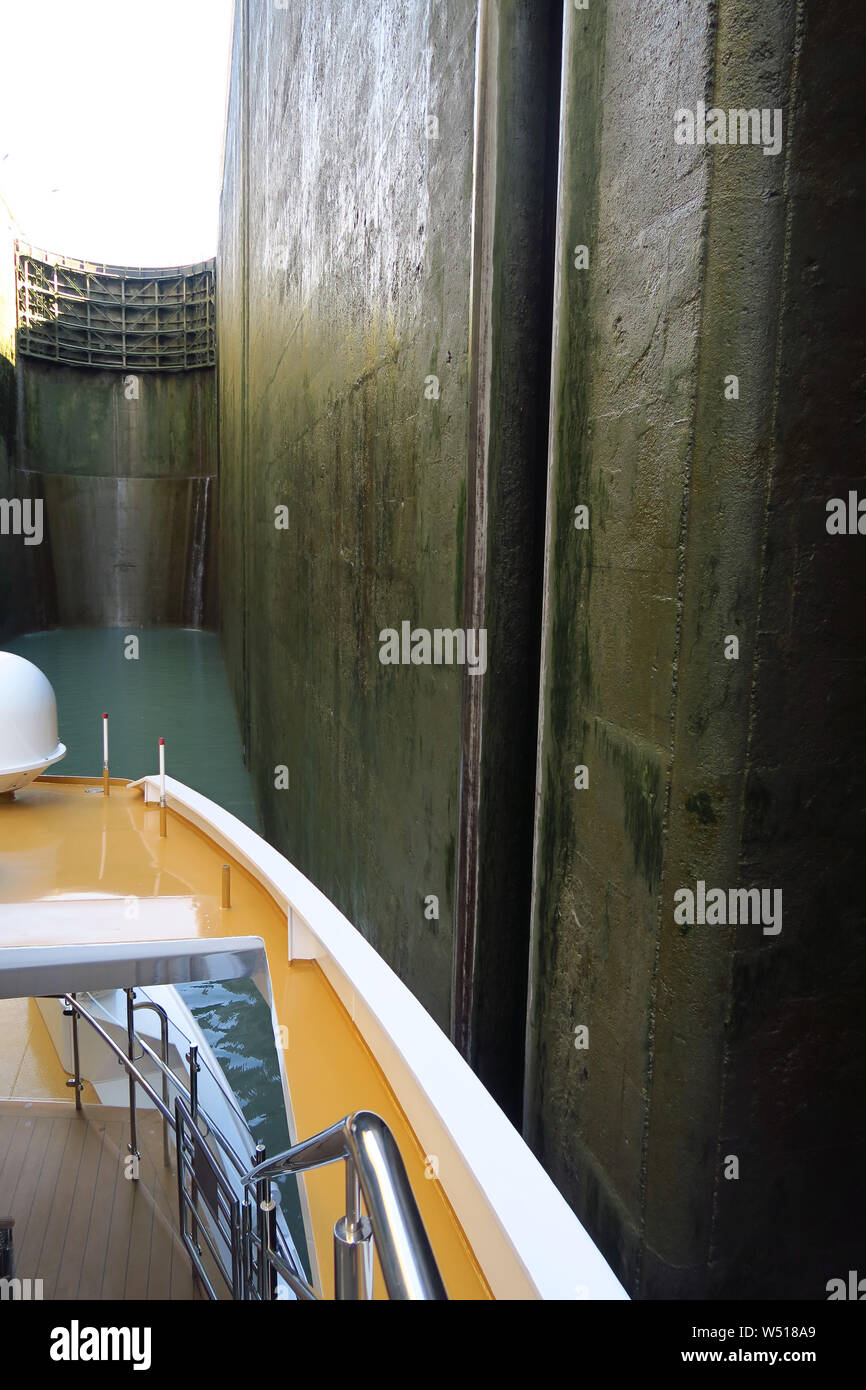 A riverboat negotiating the lock chamber at Bollene on the River Rhone ...