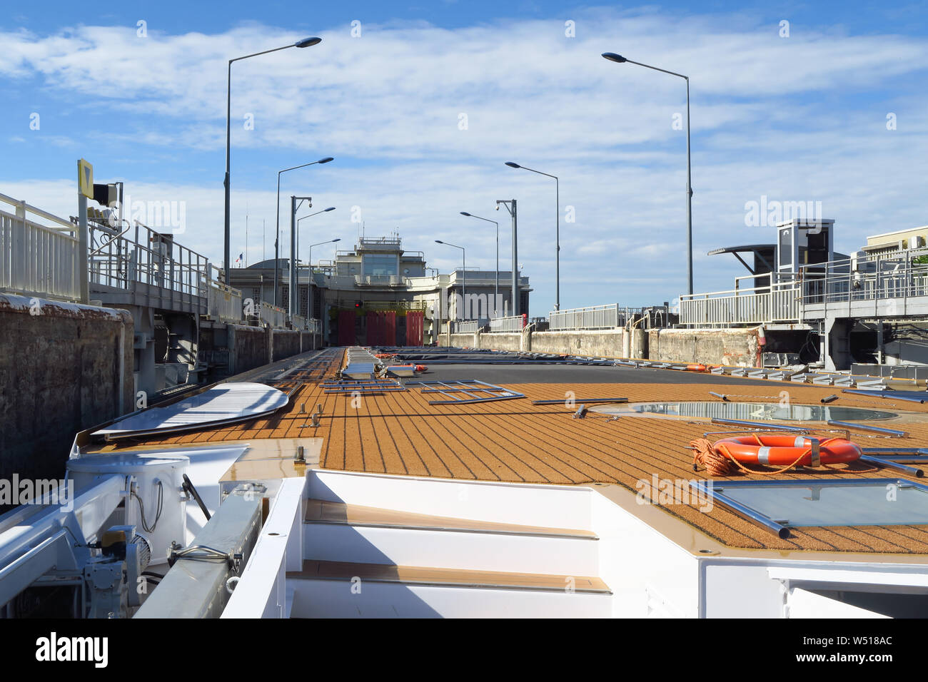 A riverboat negotiating the lock chamber at Bollene on the River Rhone ...