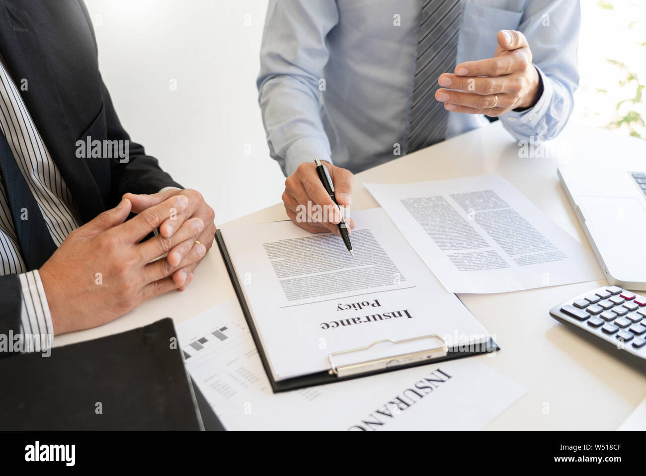 Confident insurance agent broker man holding document and present ...