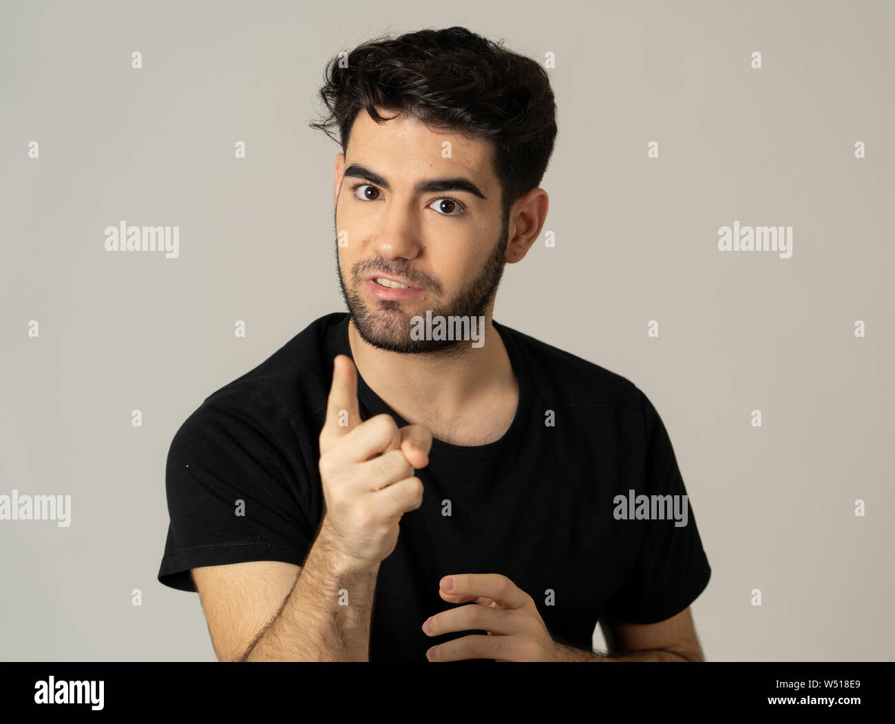 Portrait of angry and upset young man looking furious, aggressive and ...