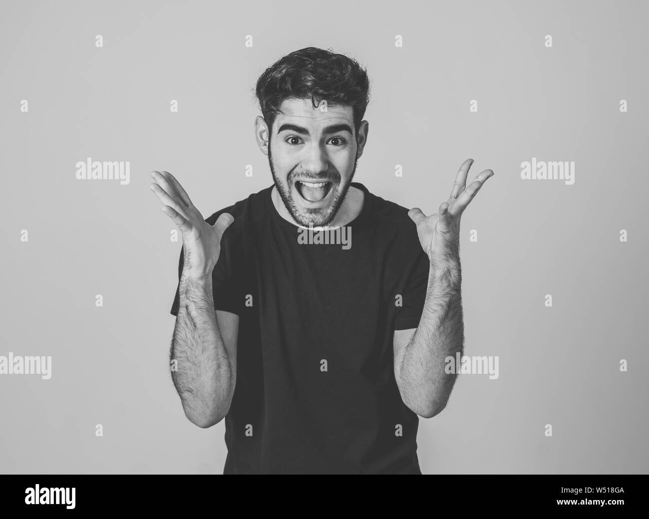 Teenager man amazed handsome Black and White Stock Photos & Images - Alamy