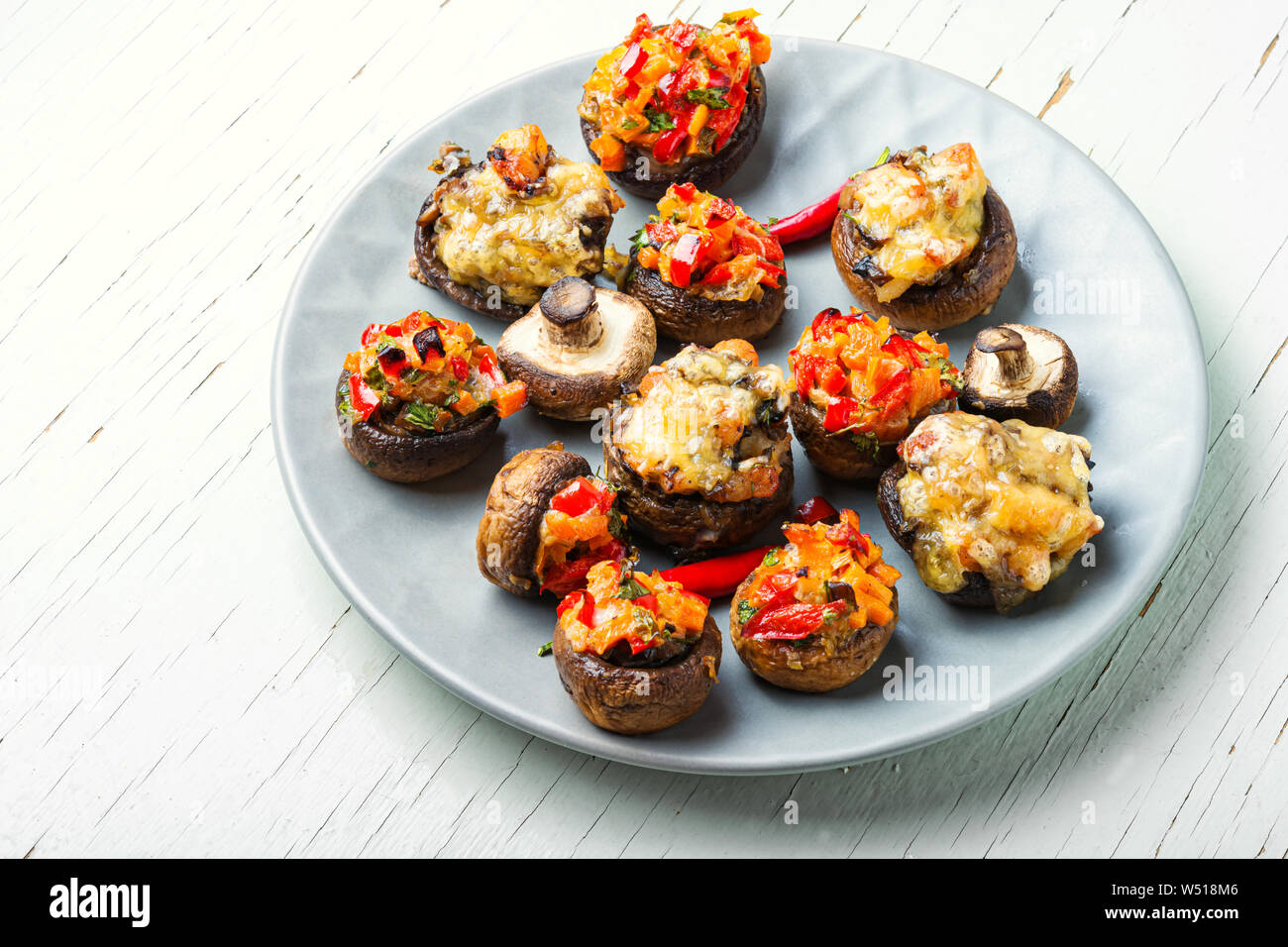 Italian stuffed mushroom caps stuffed on plate.Autumn food Stock Photo ...