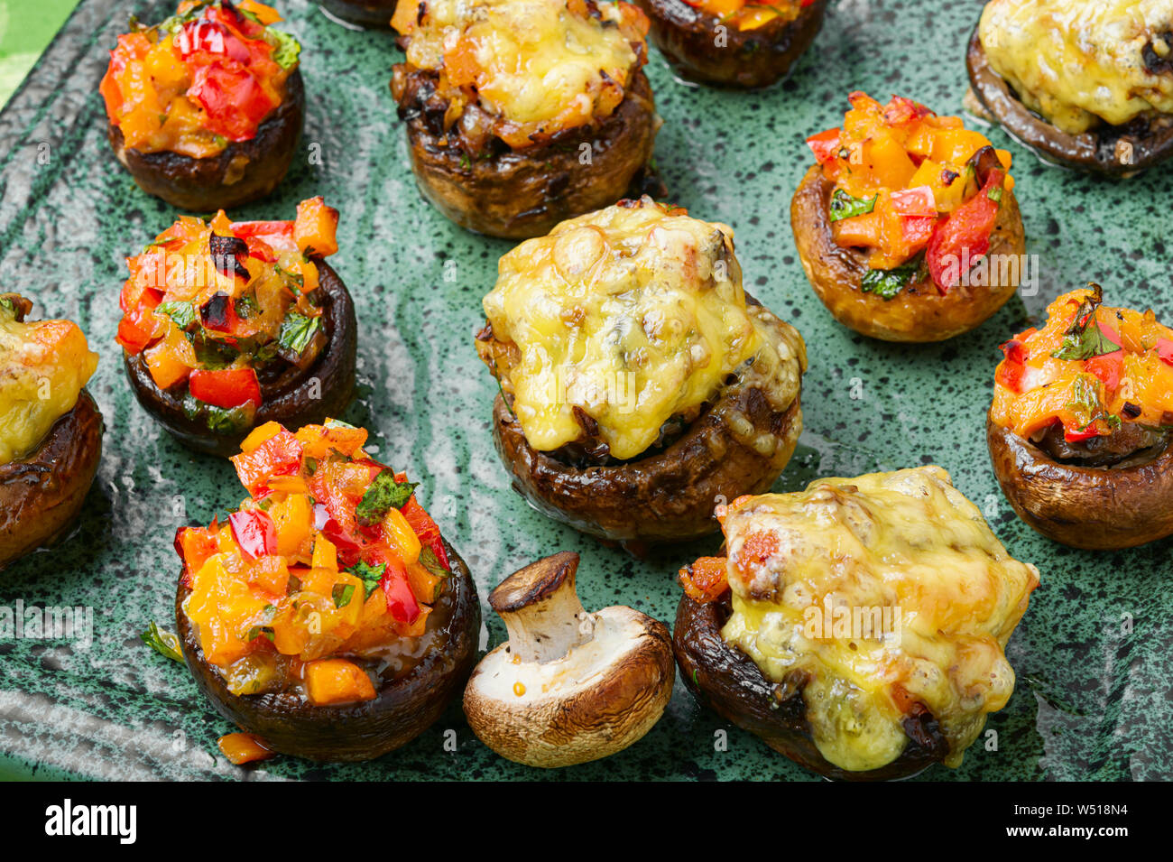 Italian stuffed mushroom caps stuffed on plate.Autumn food Stock Photo ...
