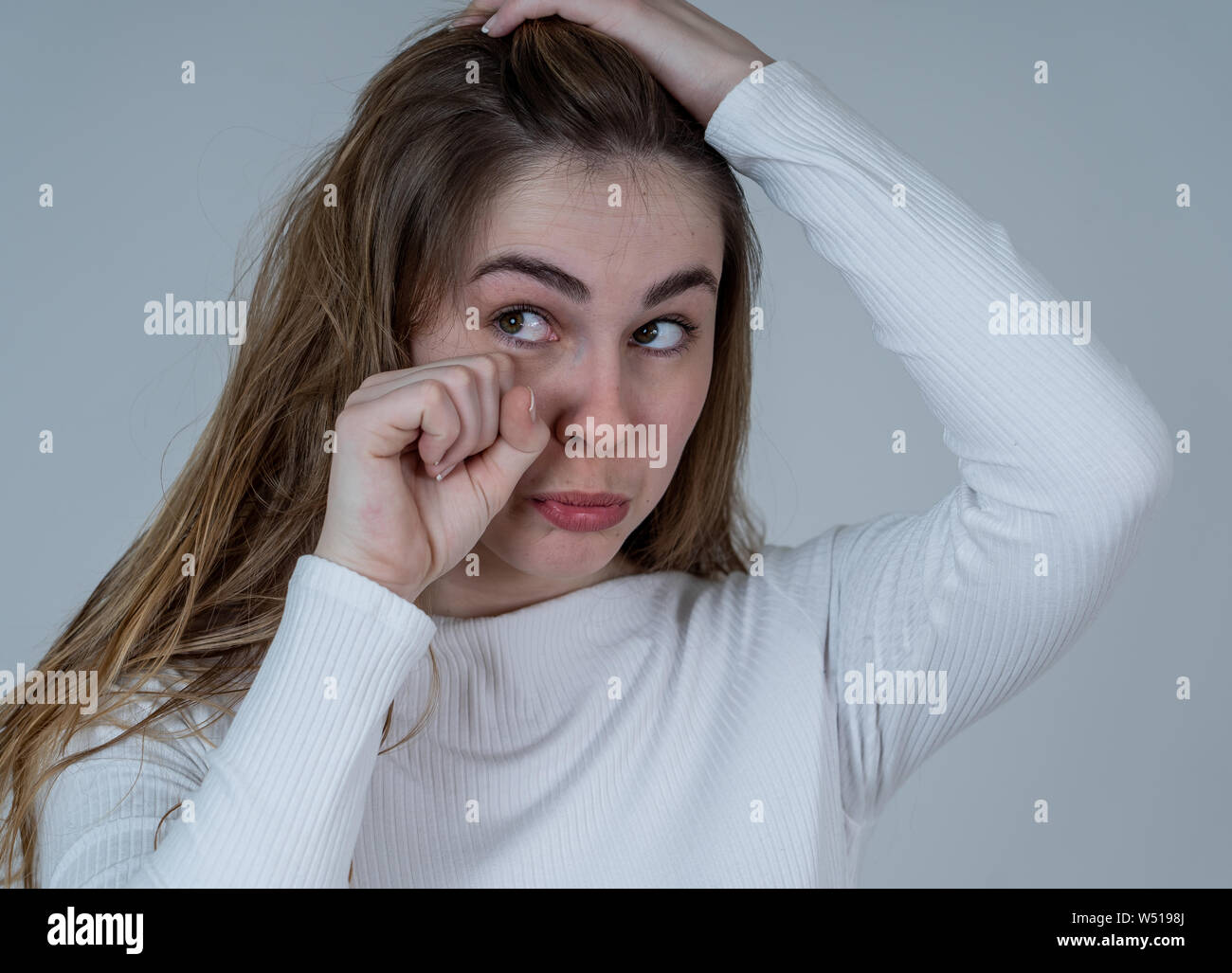 Portrait of beautiful teenager girl with funny sad faces looking sweet ...
