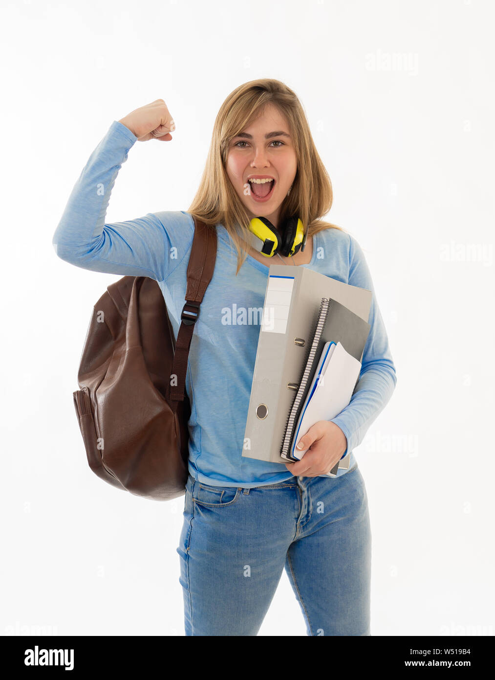 Beautiful millennial teenager girl with backpack and folder smiling and ...