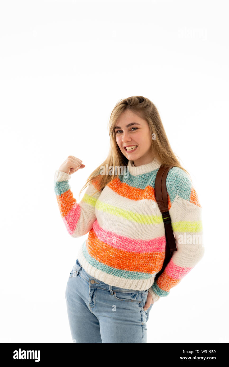 Beautiful millennial teenager girl with backpack and folder smiling and ...
