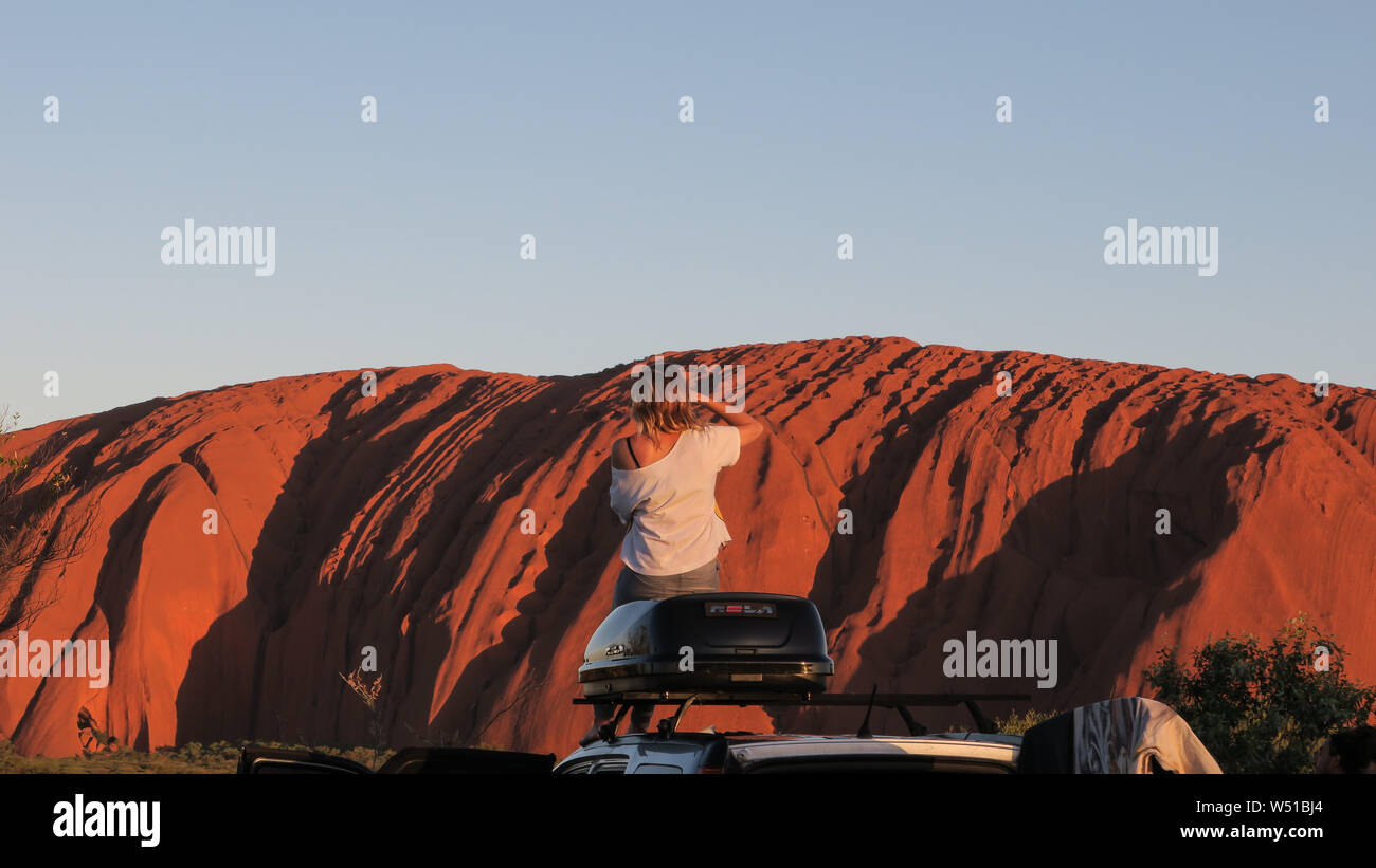 Tourism at Uluru or Ayers Rock in Central Australia, the huge sandstone ...
