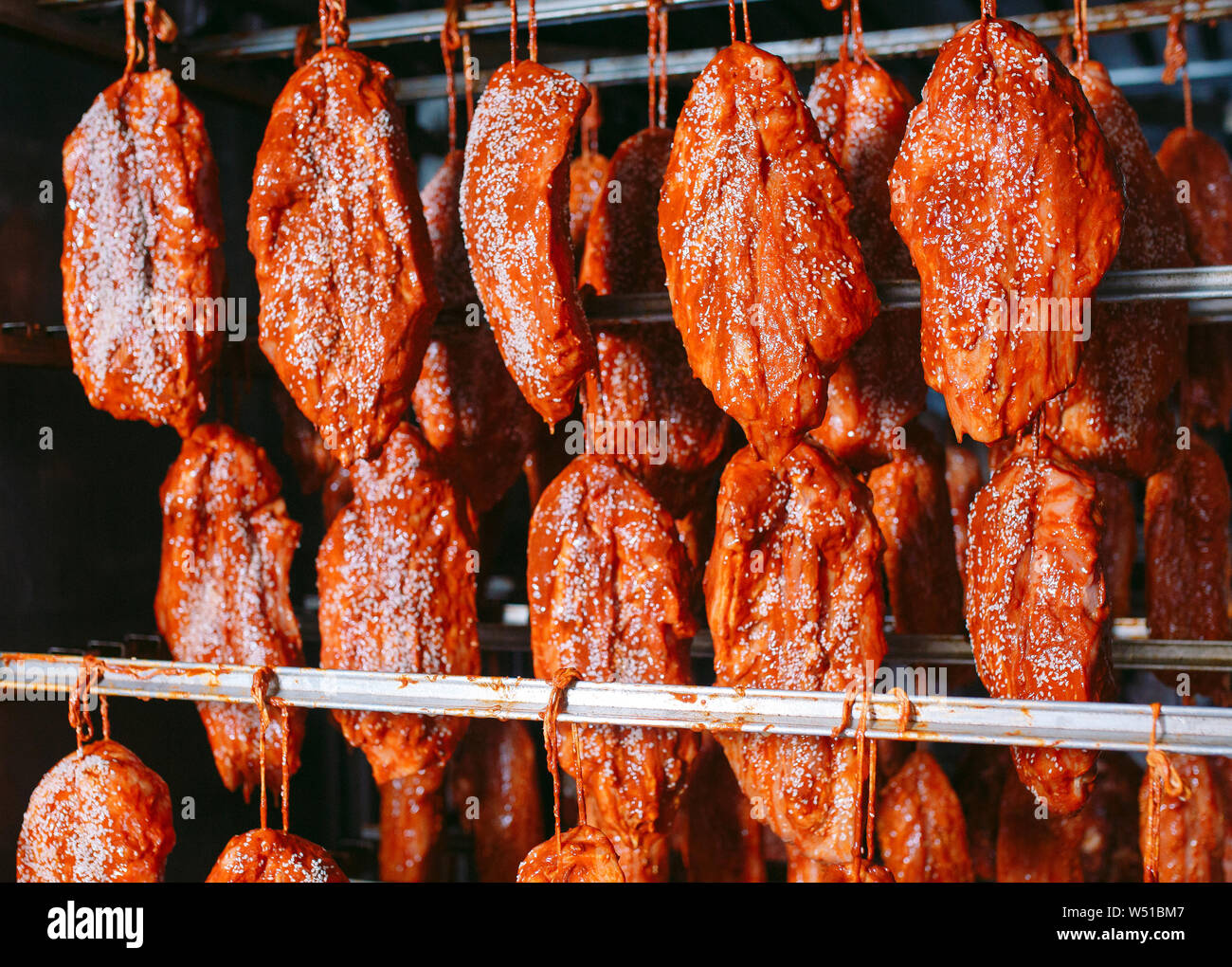 Smoked ham in the oven. Sausage production in the factory Stock Photo ...