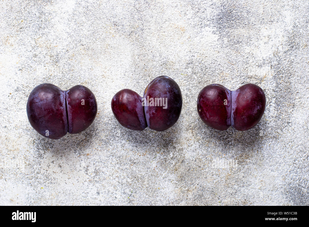 Ugly plums. Abnormal organic fruit Stock Photo - Alamy