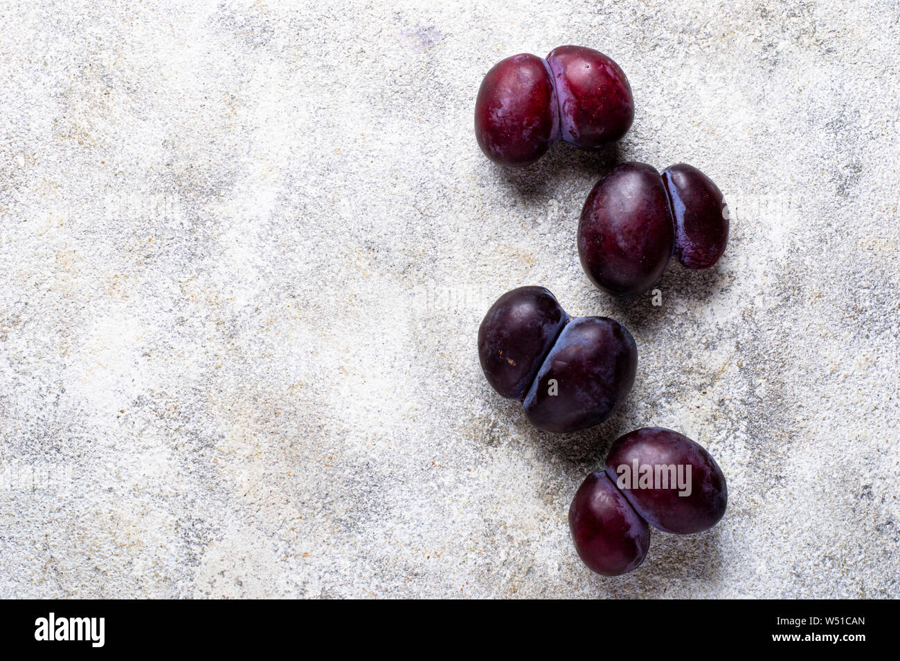 Ugly plums. Abnormal organic fruit Stock Photo - Alamy