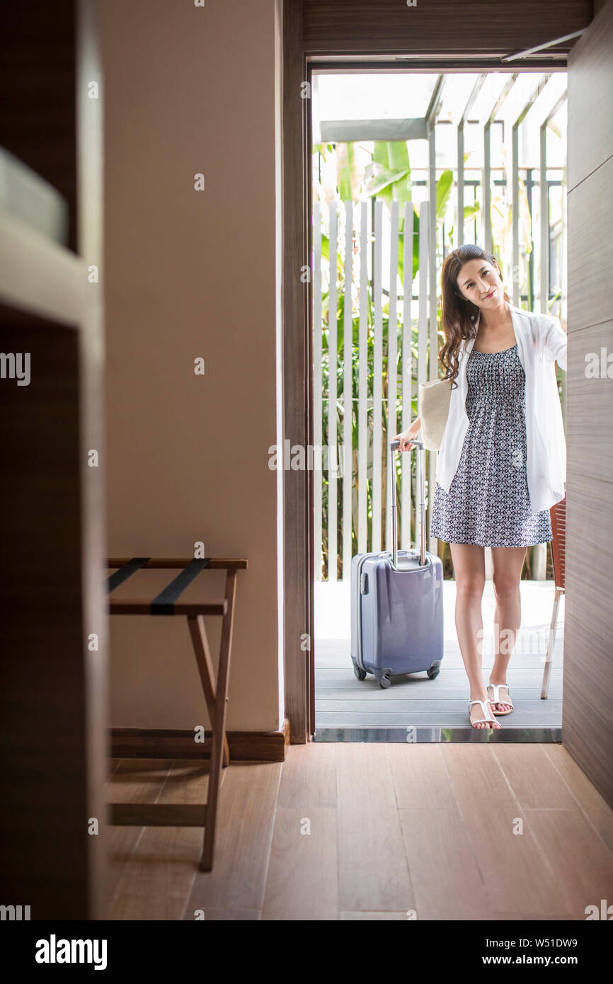 Woman happy hotel room door hi-res stock photography and images - Alamy