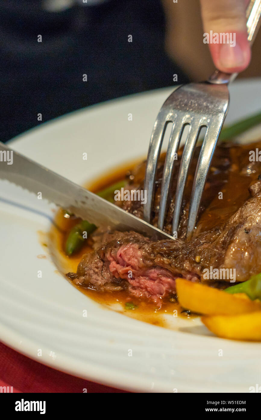 Human hand holding knife fork hi-res stock photography and images - Alamy