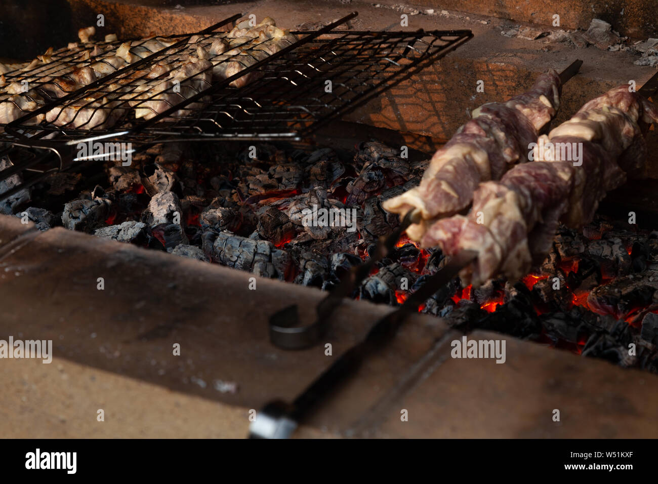 Close-up on the process of cooking barbecue of pork or beef meat ...