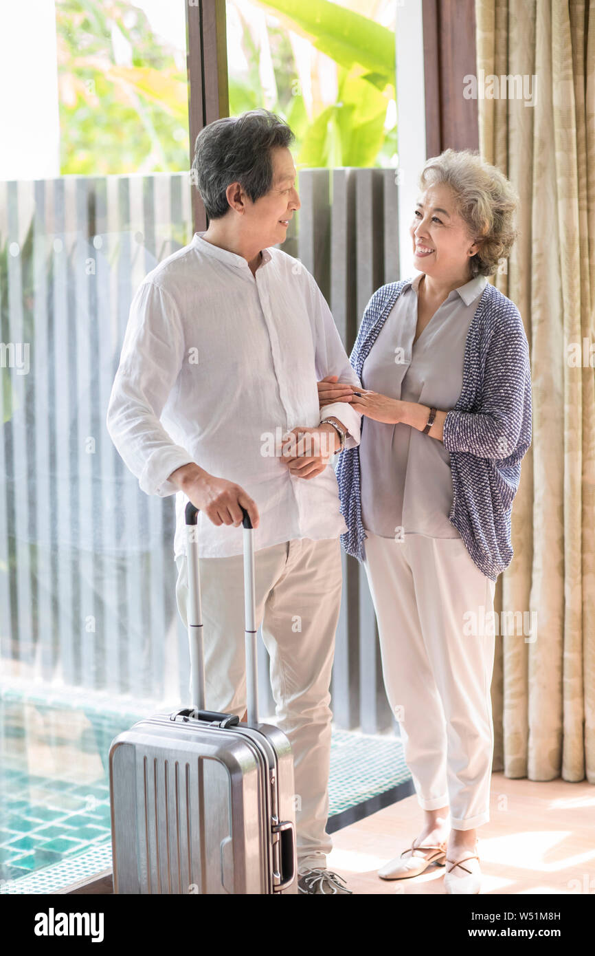 Happy senior couple in hotel room Stock Photo - Alamy