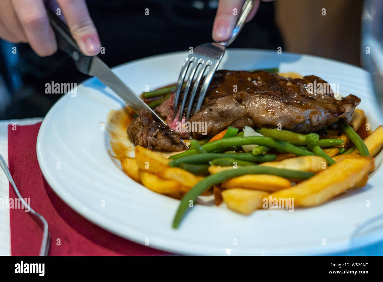 Using knife and fork hi-res stock photography and images - Alamy