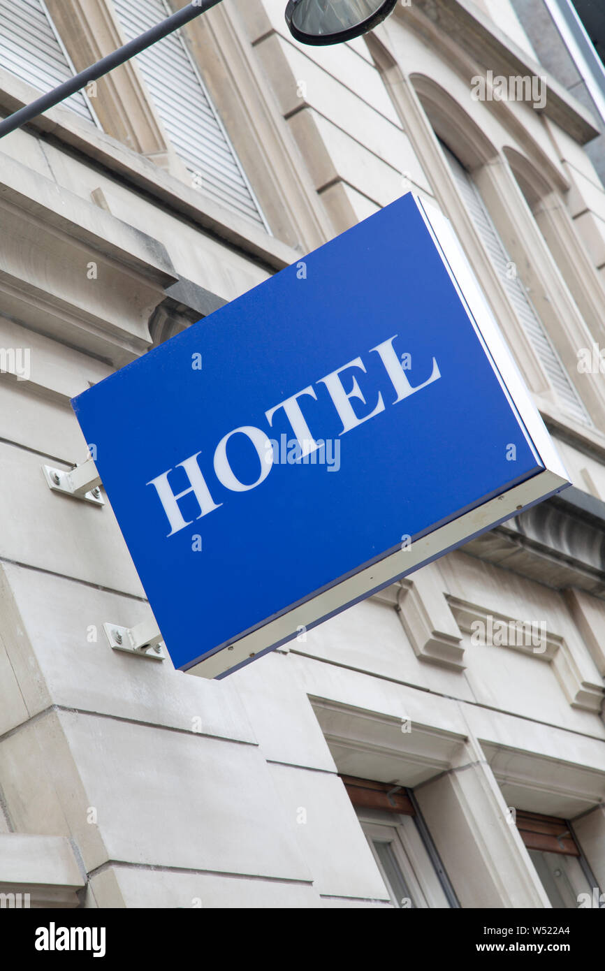 Blue Hotel Sign on Diagonal Slant Stock Photo - Alamy