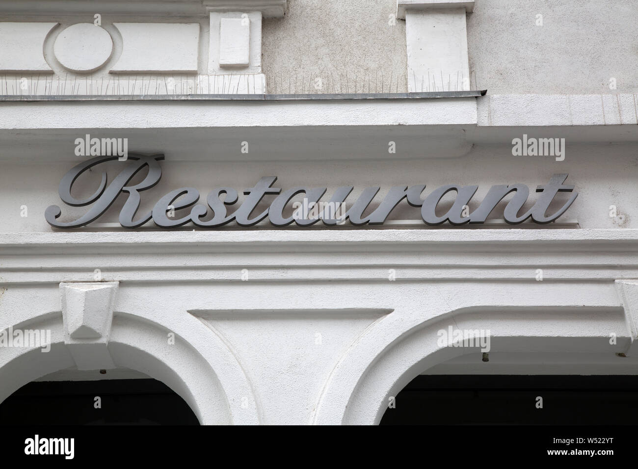 Restaurant Sign on Building Facade Stock Photo - Alamy