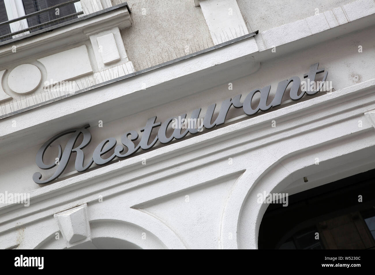 Restaurant Sign on Building Facade Stock Photo - Alamy