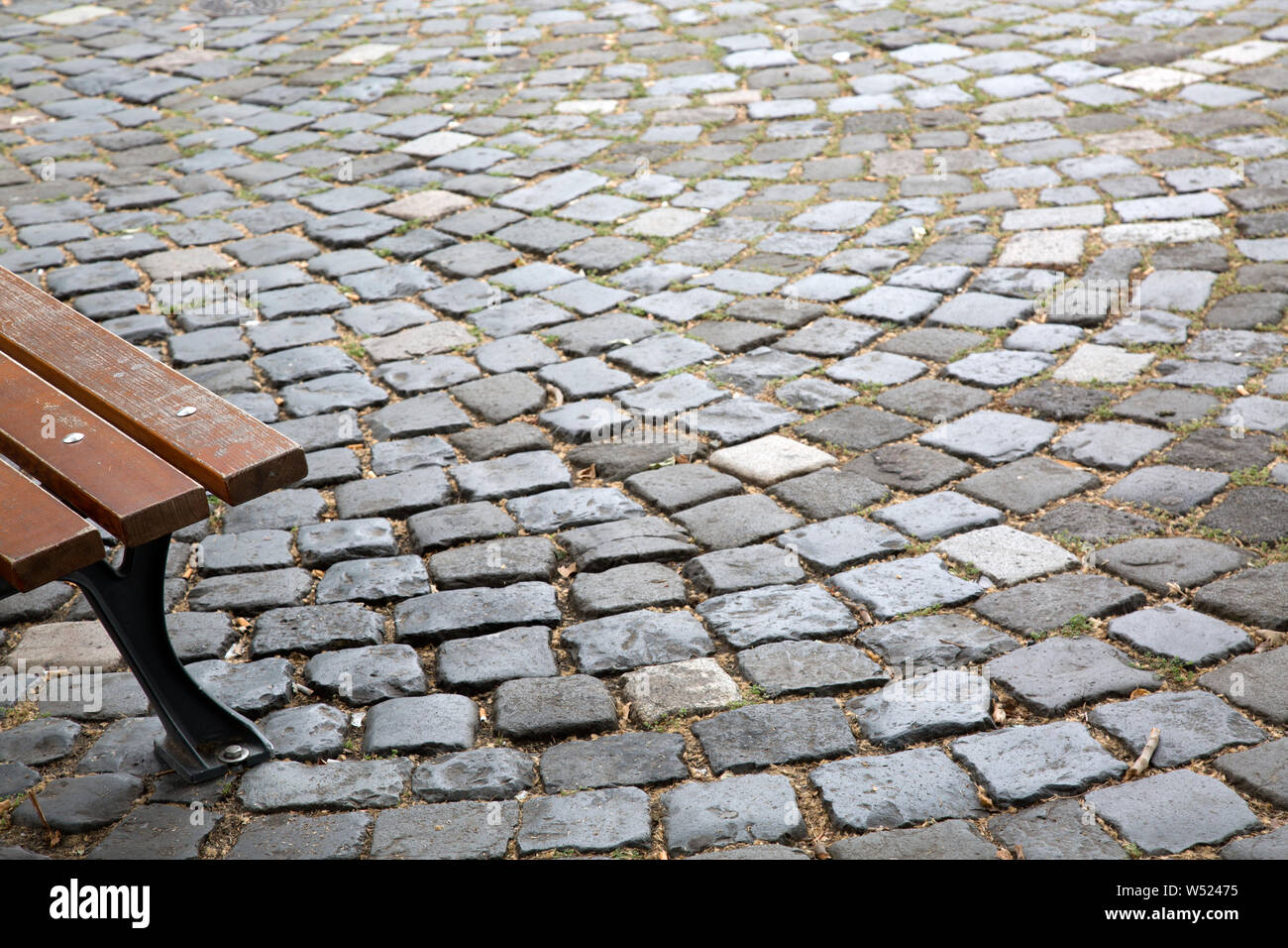 Wooden Bench on Cobblestone Background, Frankfurt, Germany Stock Photo ...