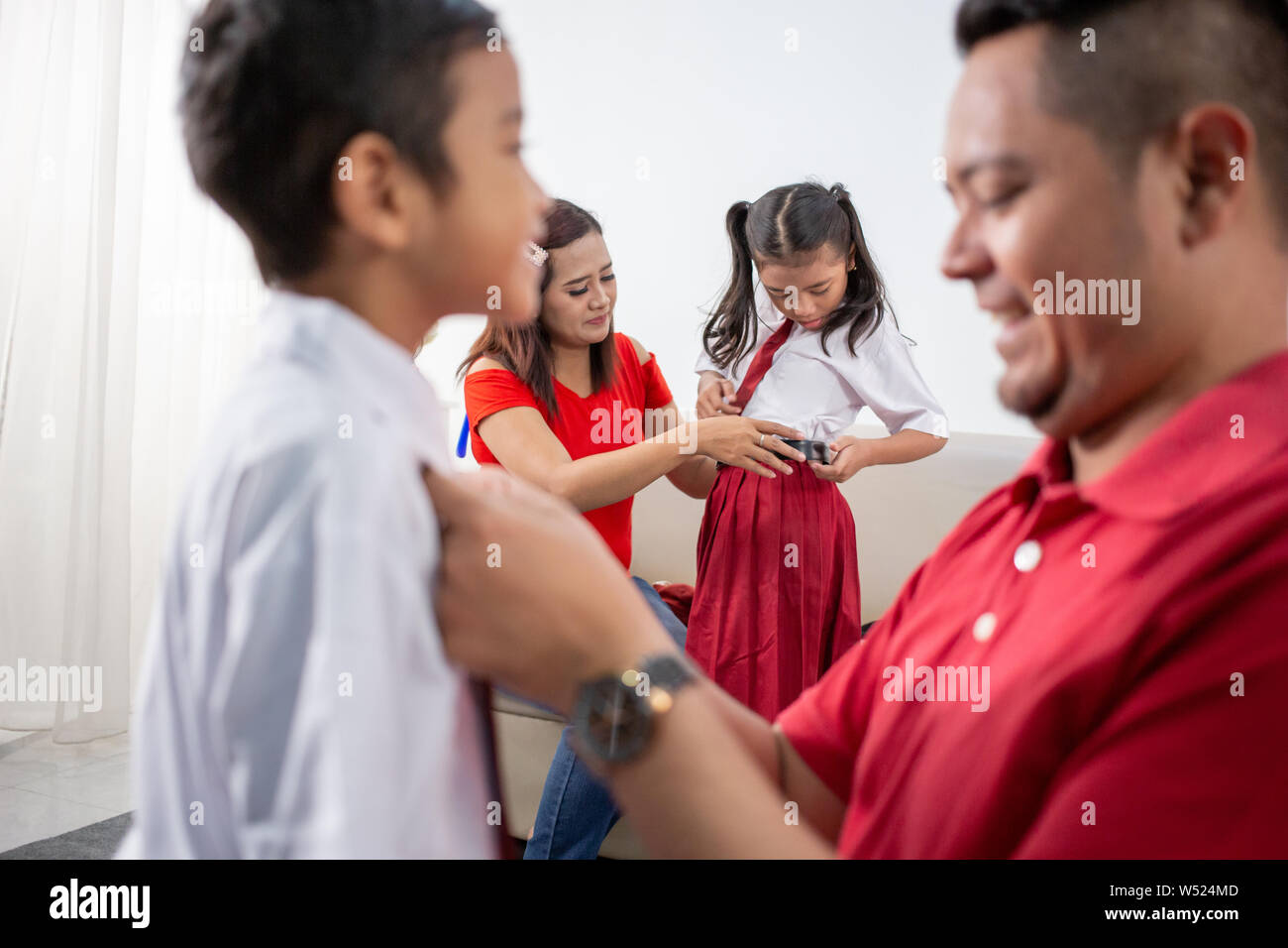 parent help their children getting ready for school Stock Photo - Alamy