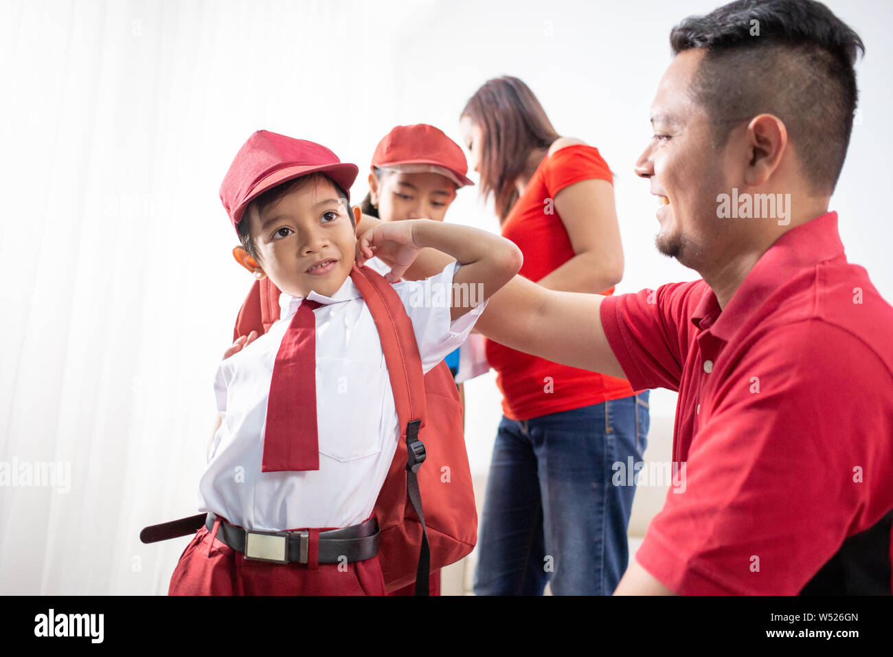 parent help their children getting ready for school Stock Photo - Alamy