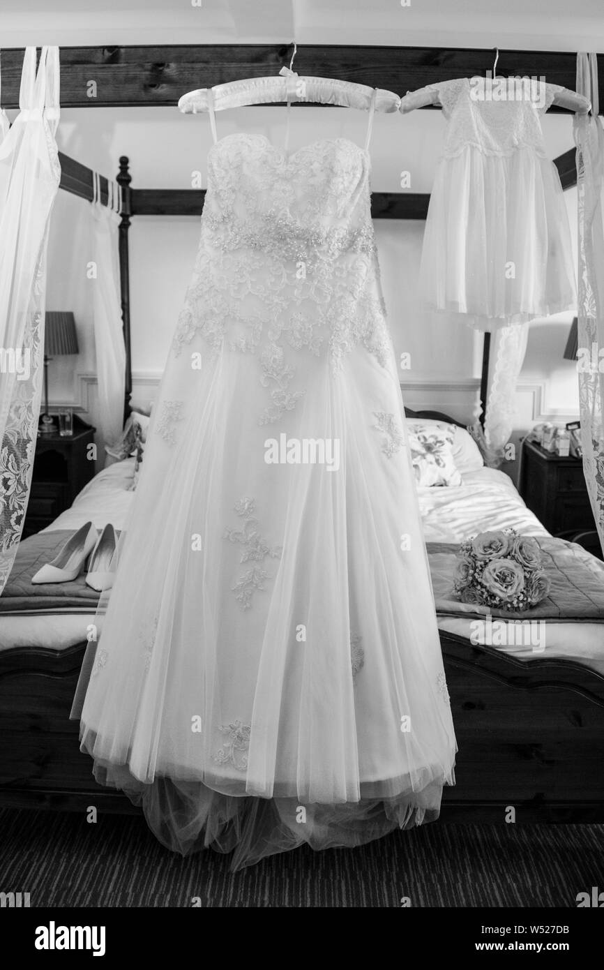 Wedding Dress hanging up waiting to be worn on the Brides wedding day ...