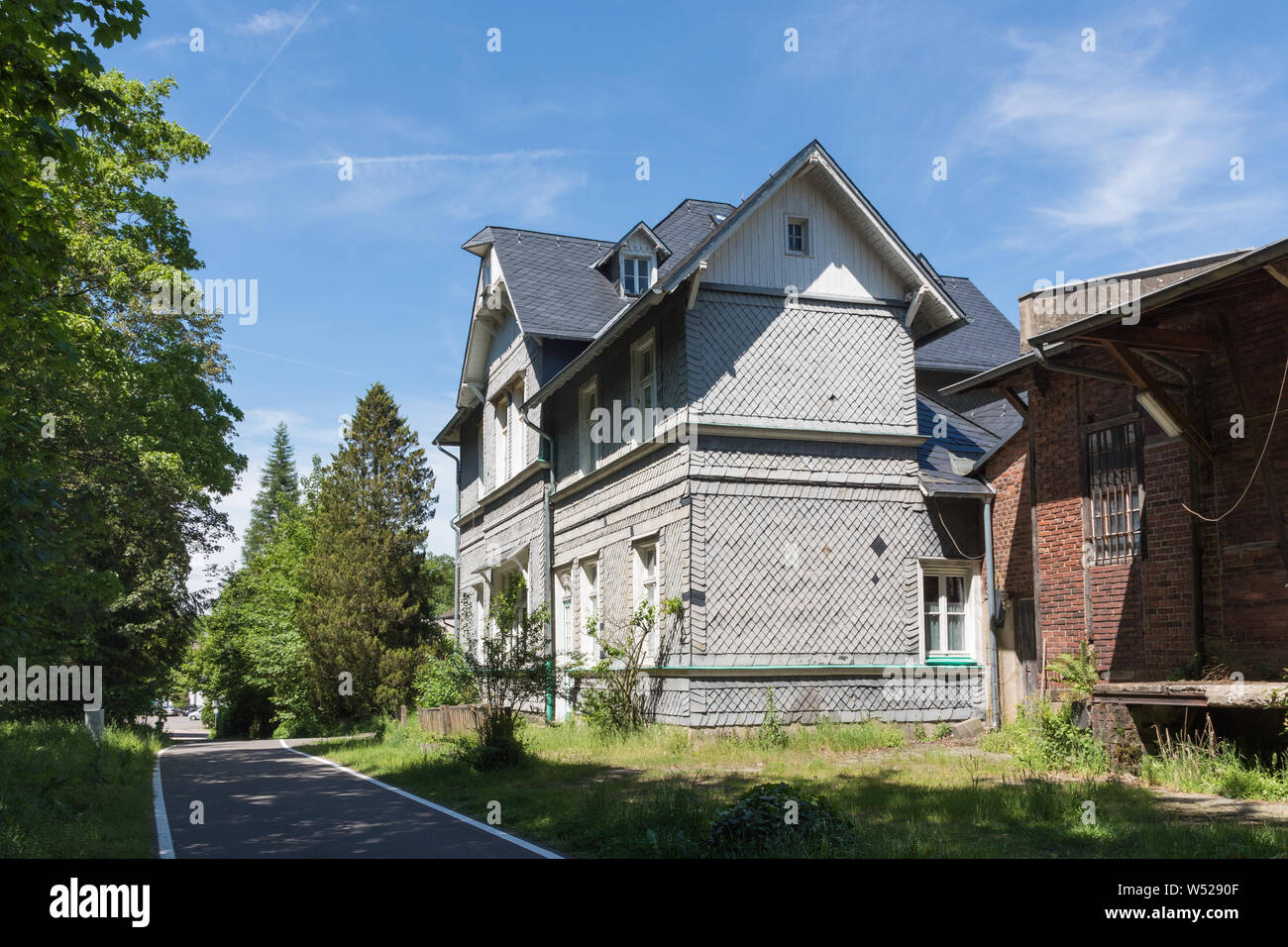 Old railway station and rail tracks now a cycle path in Ohl, Germany ...