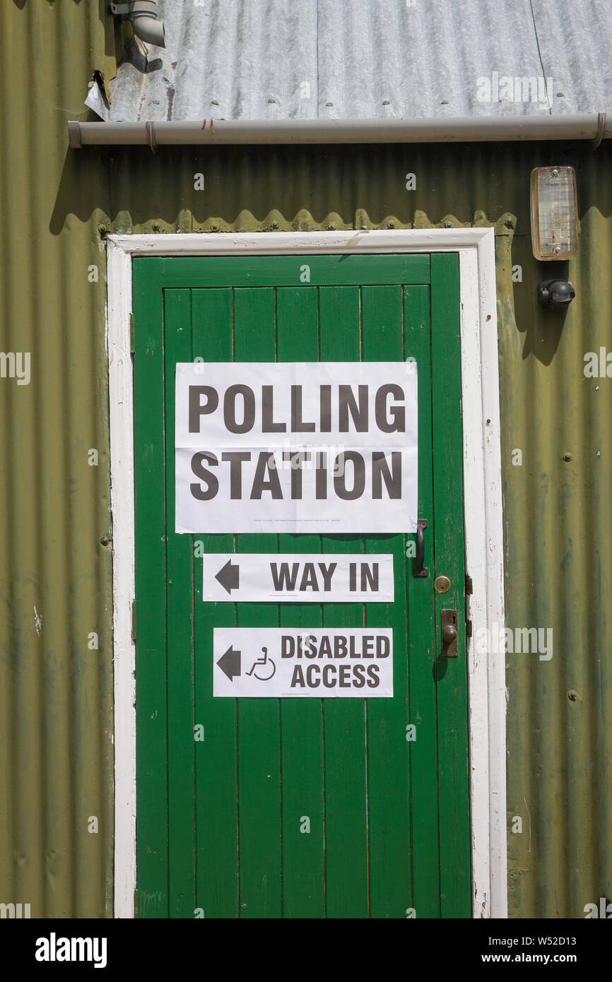 Paper signs on a green door outside a Polling Station showing the Way ...
