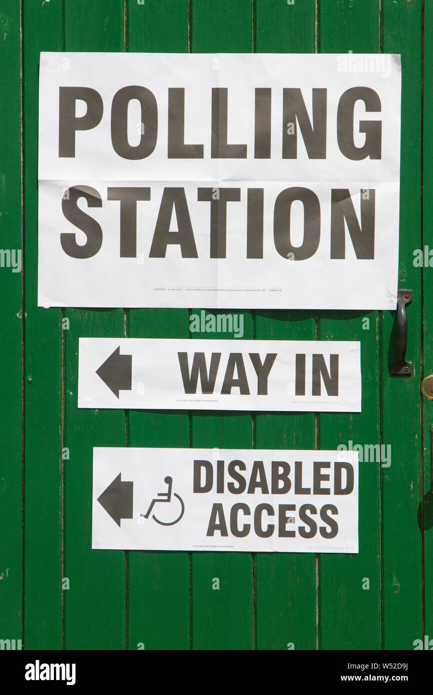 Paper signs on a green door outside a Polling Station showing the Way ...